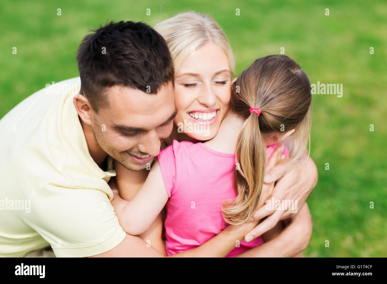 happy family hugging outdoors Stock Photo - Alamy