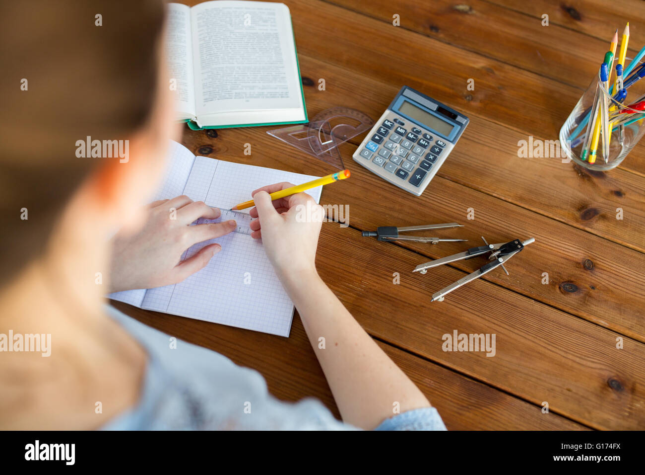 close up of hands with ruler and pencil drawing Stock Photo - Alamy