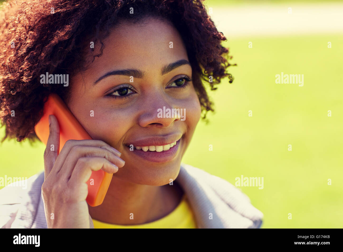 happy african woman calling on smartphone outdoors Stock Photo - Alamy