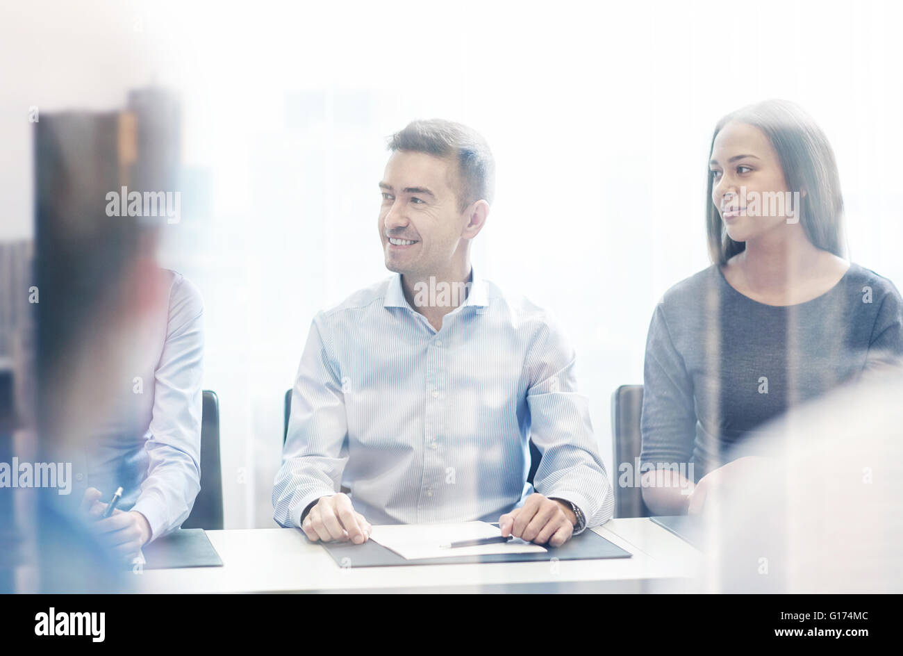 group of smiling businesspeople meeting in office Stock Photo - Alamy