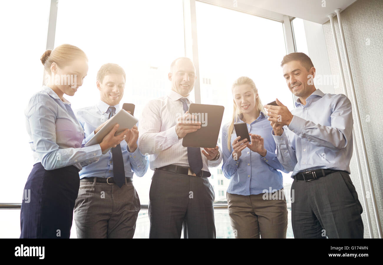 business people with tablet pc and smartphones Stock Photo - Alamy