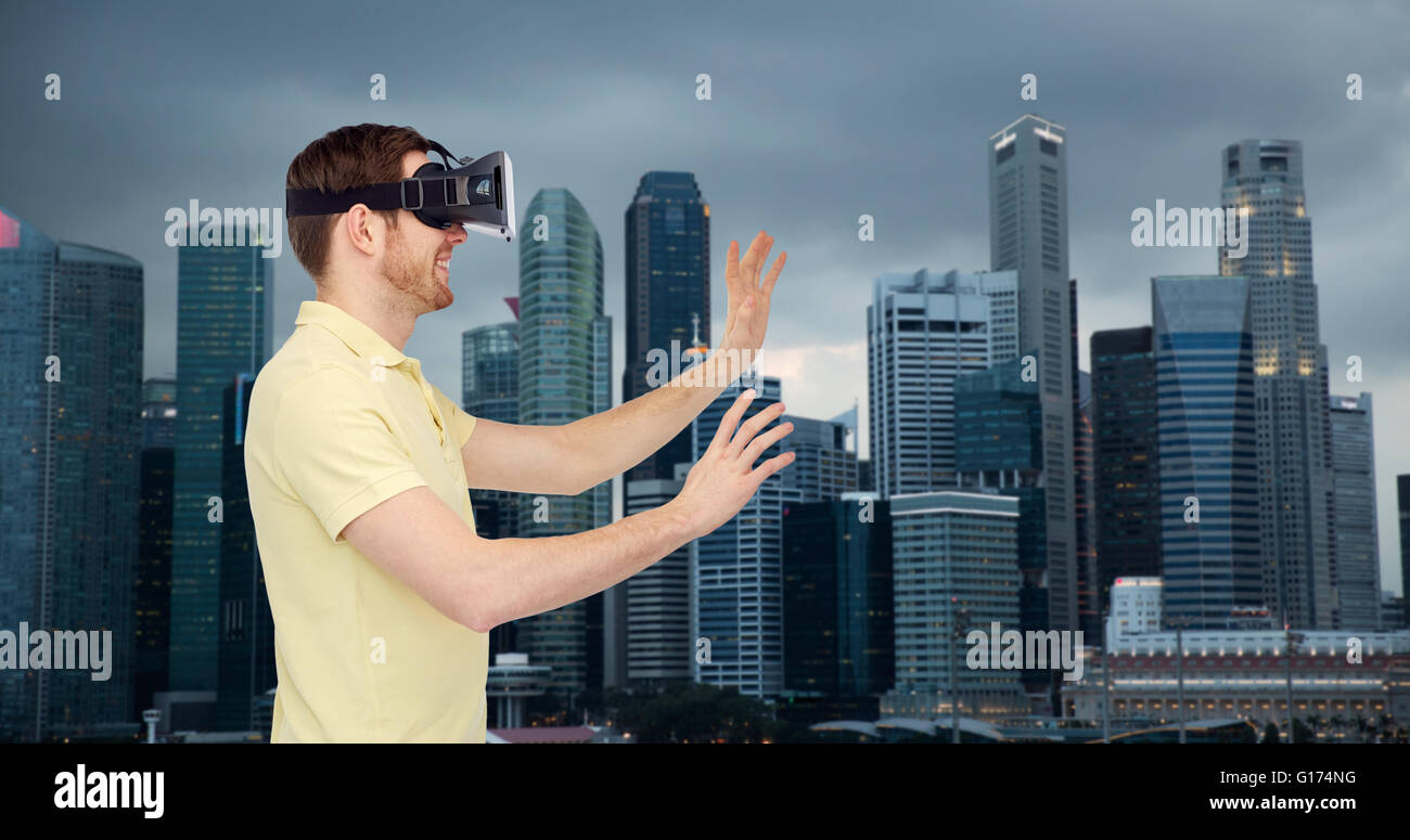 happy man in virtual reality headset or 3d glasses Stock Photo - Alamy