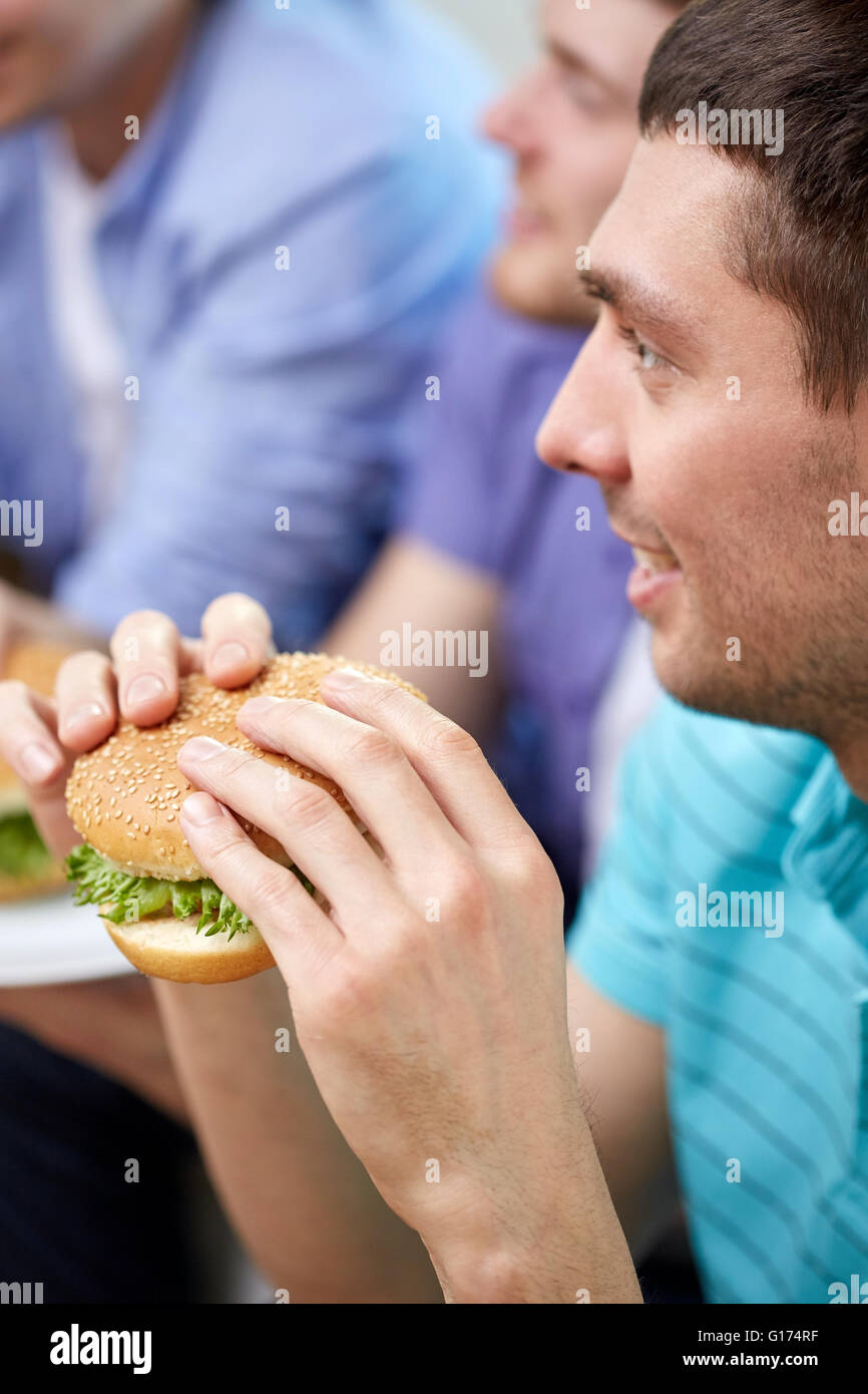 Latin man eating hamburger hi-res stock photography and images - Alamy
