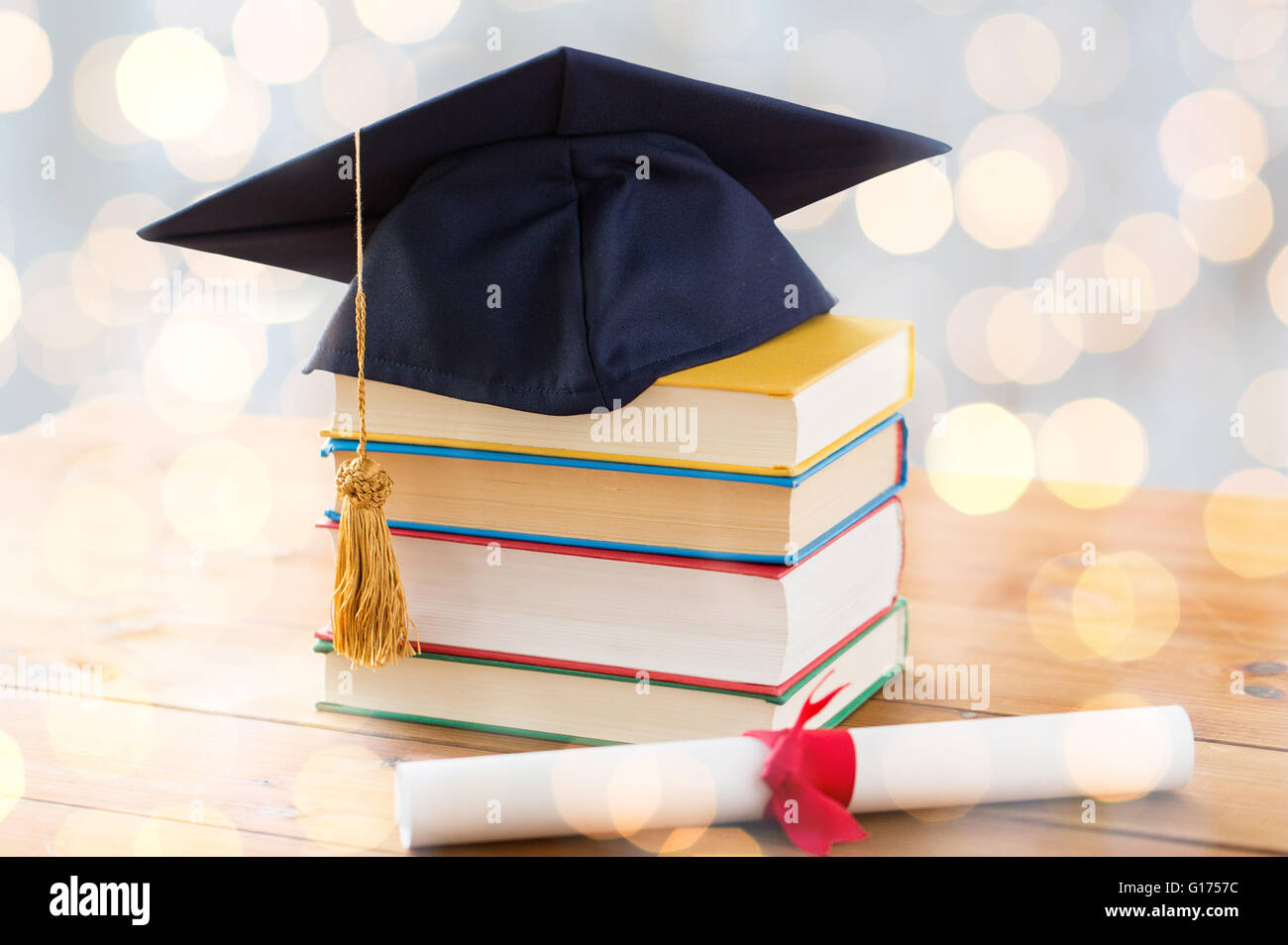 close up of books with diploma and mortarboard Stock Photo - Alamy
