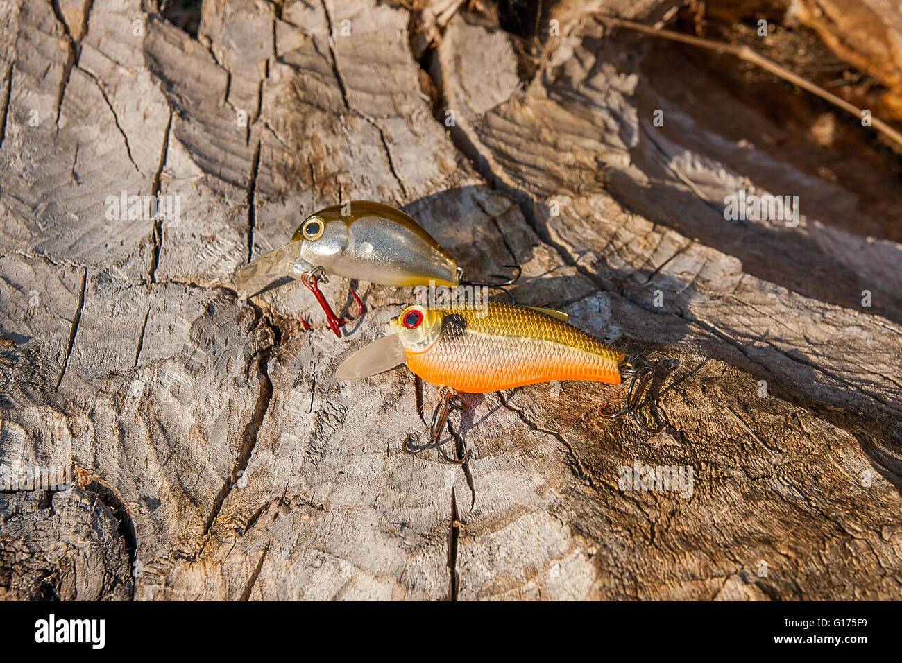 Assorted of various kind of fishing baits on the natural background ...