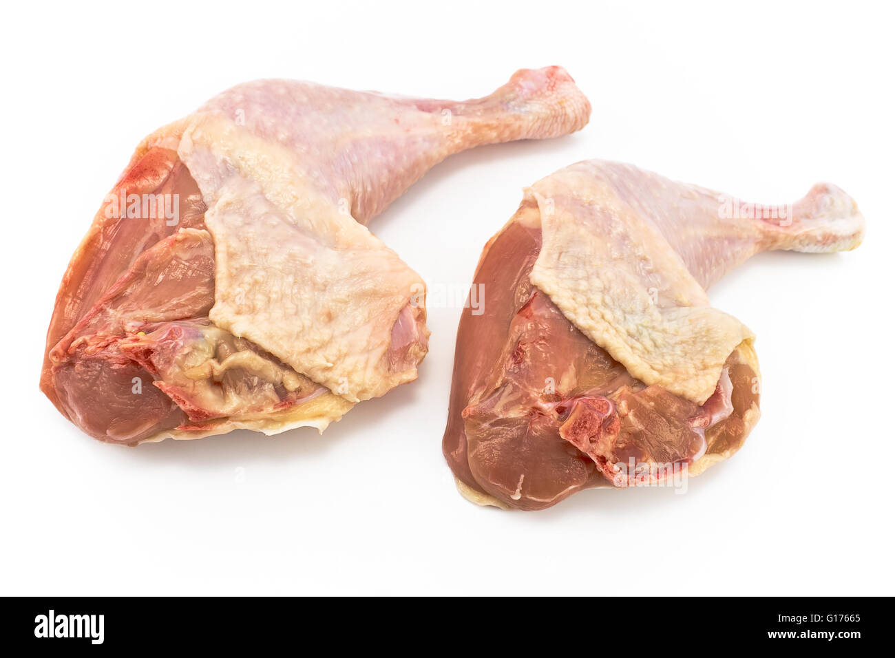 Raw chicken legs isolated on white Stock Photo - Alamy