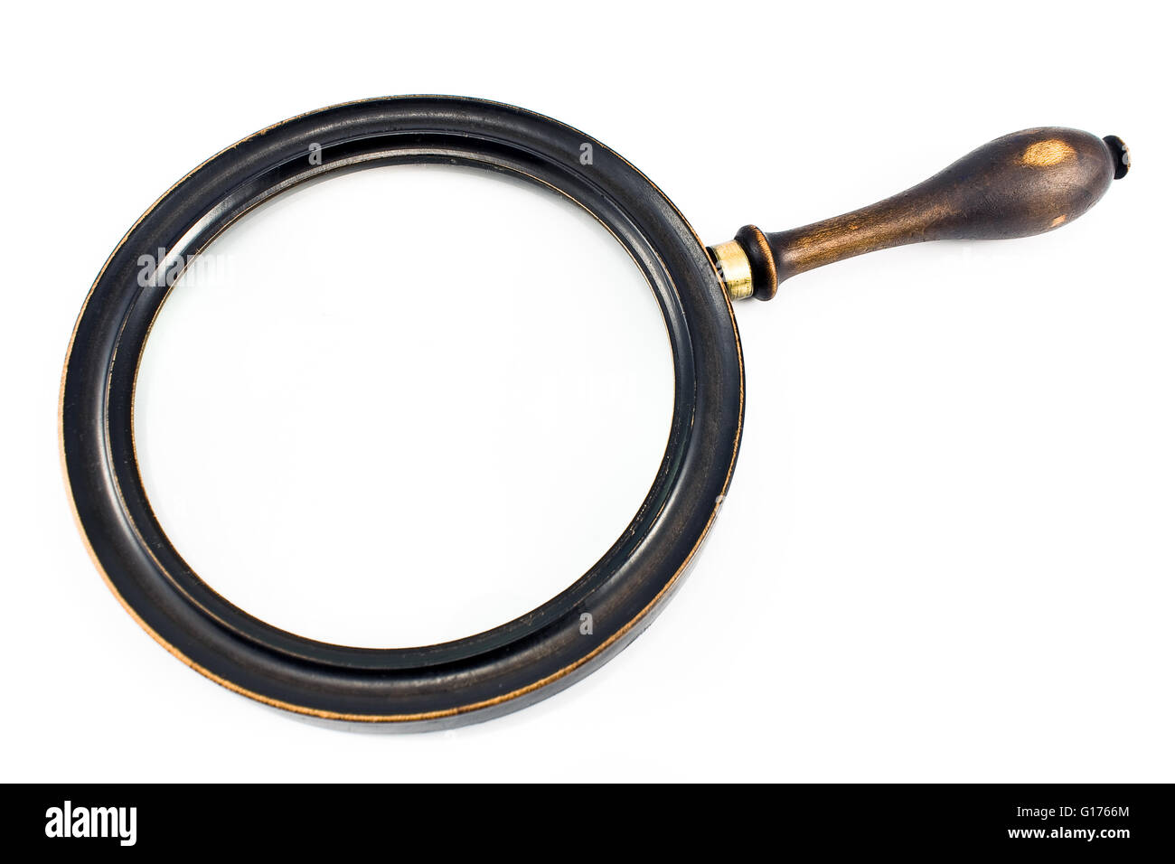 Antique magnifying glass isolated on white Stock Photo - Alamy