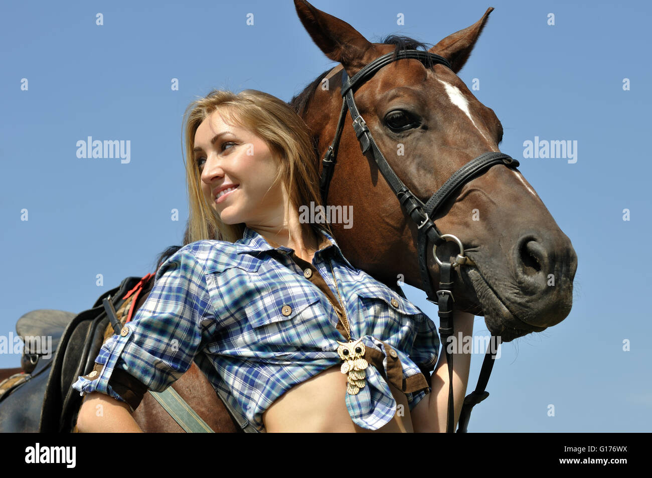 Blond woman riding horse hi-res stock photography and images - Alamy