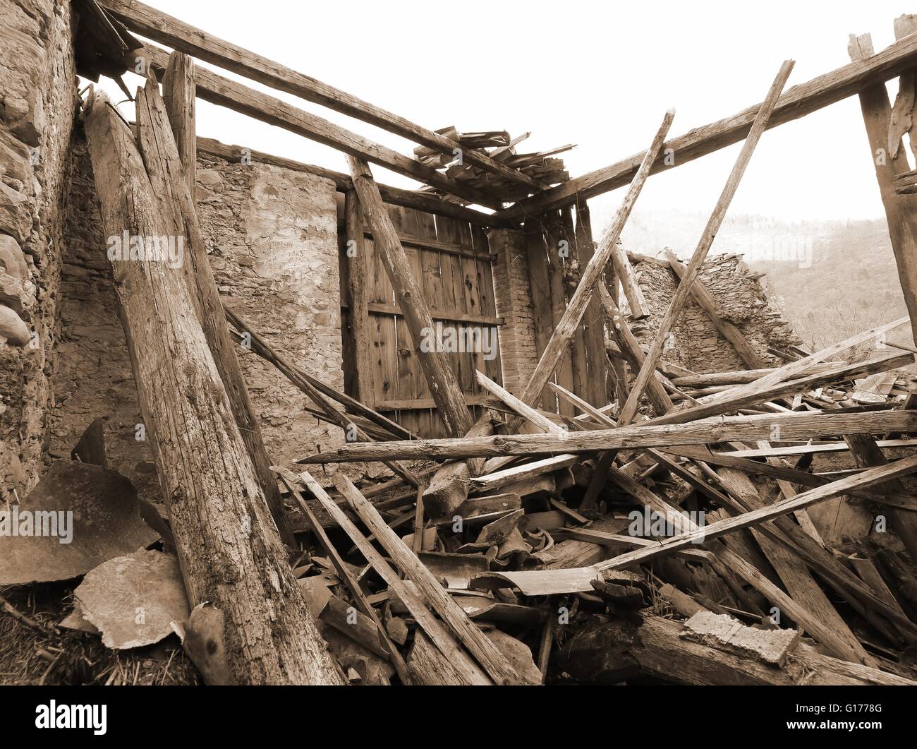 wooden planks and rubble and the ruins of the house completely ...
