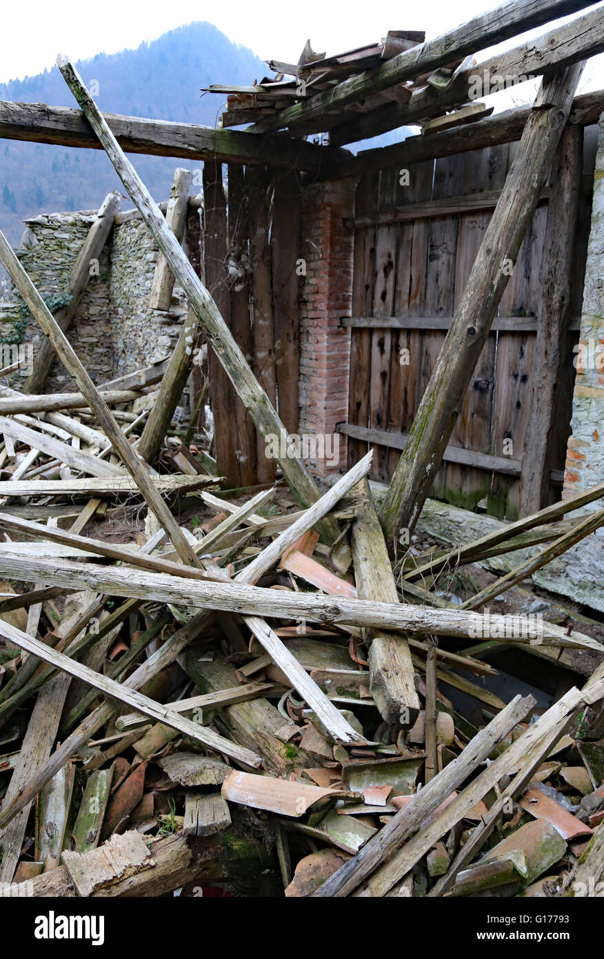 wooden planks and rubble and the ruins of the house completely ...