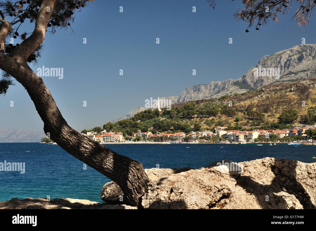 Adriatic sea at Podgora in Croatia with monument Seagull's wings and ...