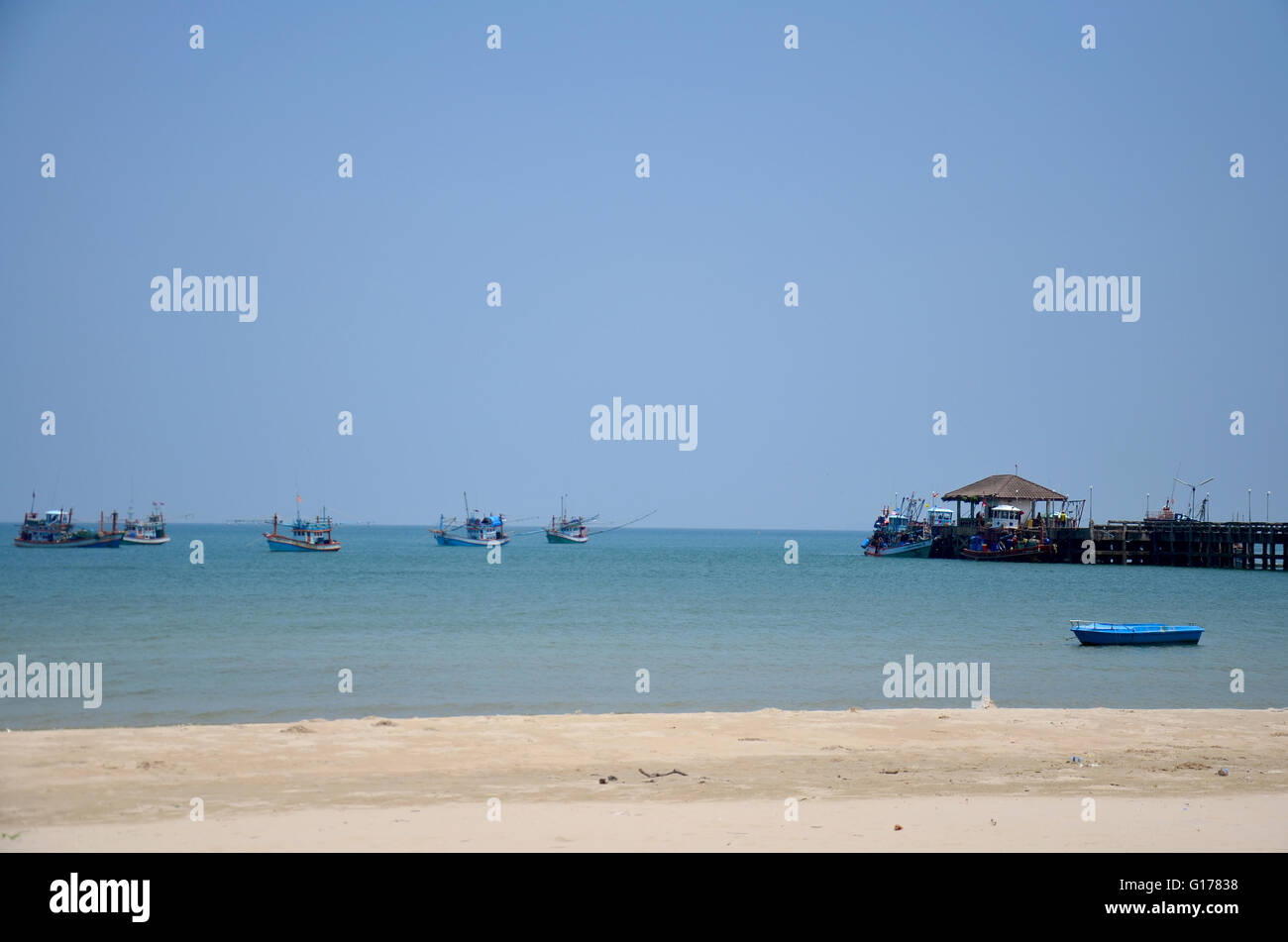 Fishing boat floating on the sea wait moored at dock in Surat Thani ...