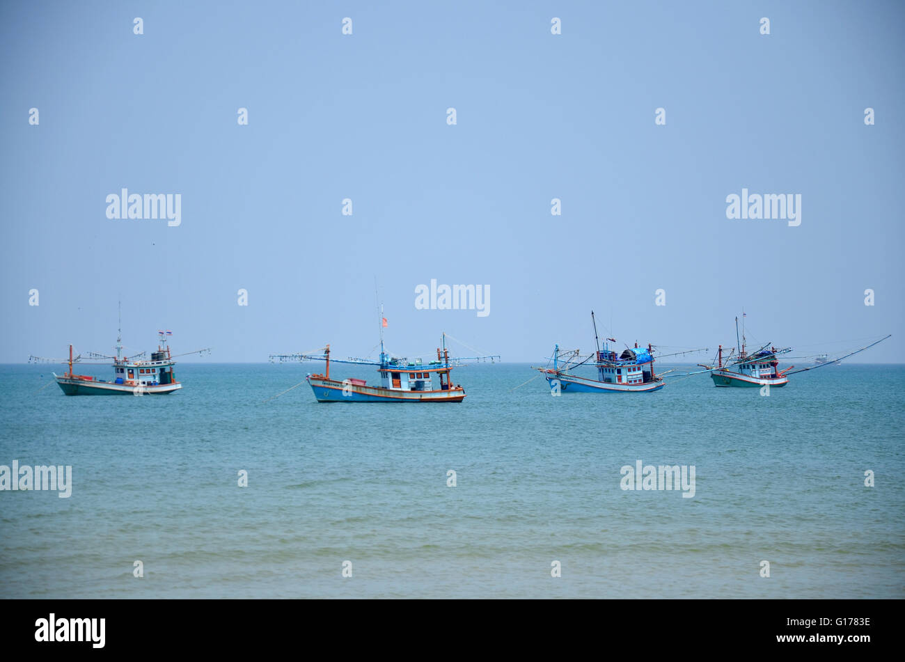 Fishing boat floating on the sea wait moored at dock in Surat Thani ...