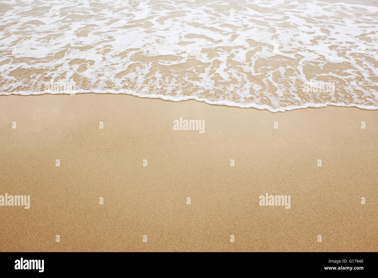 Sand beach and wave Stock Photo - Alamy