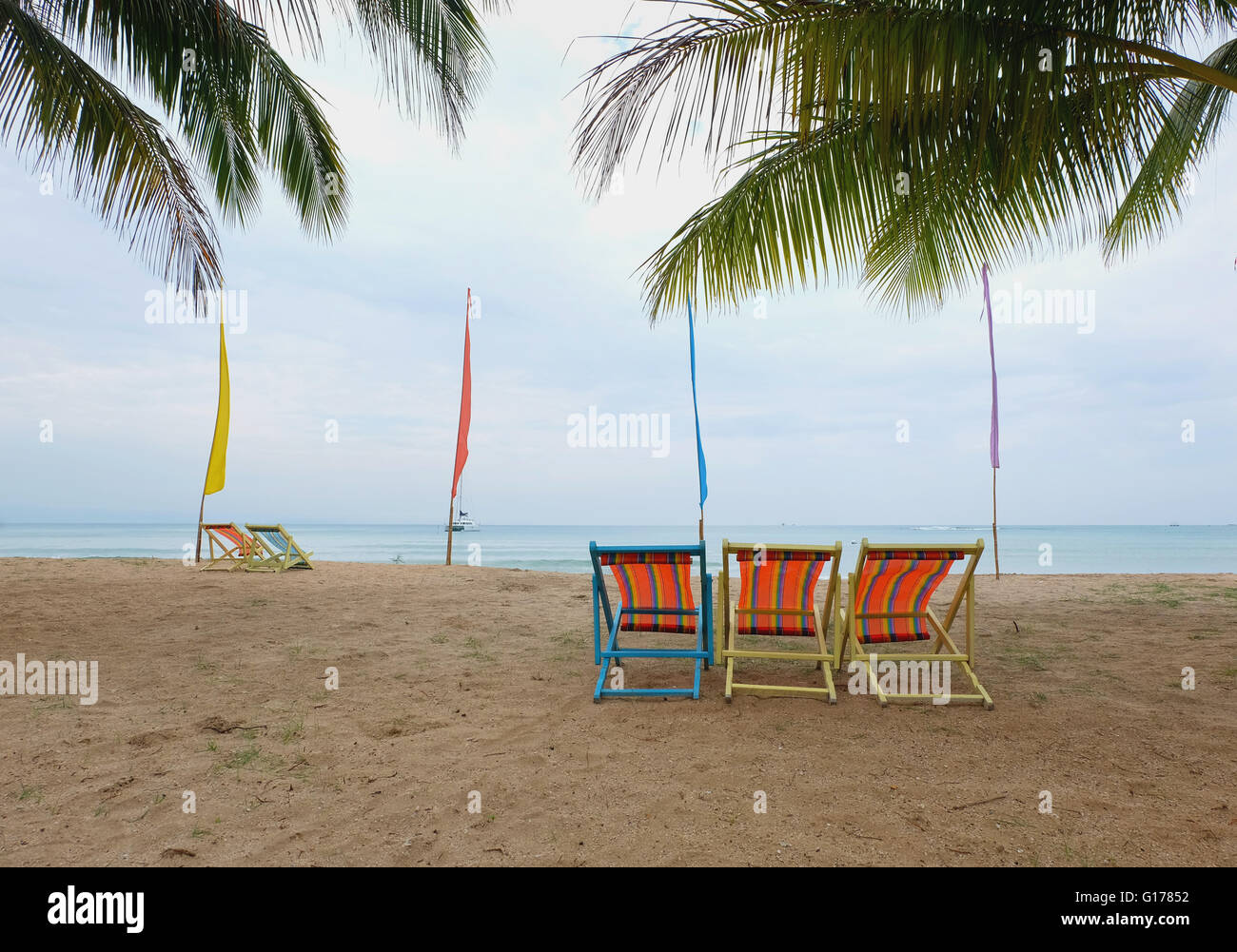 deck chair under a palm-tree on a tropical beach Stock Photo - Alamy