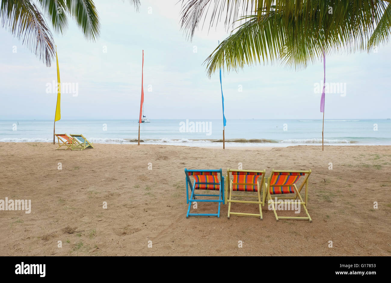 deck chair under a palm-tree on a tropical beach Stock Photo - Alamy
