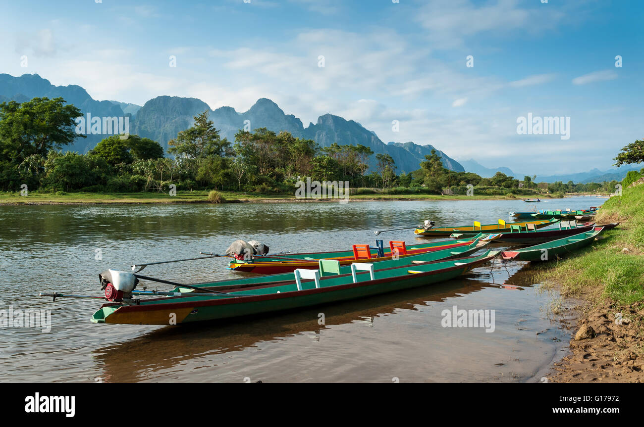 long tail boats on Song river, Vang Vieng,Laos Stock Photo - Alamy