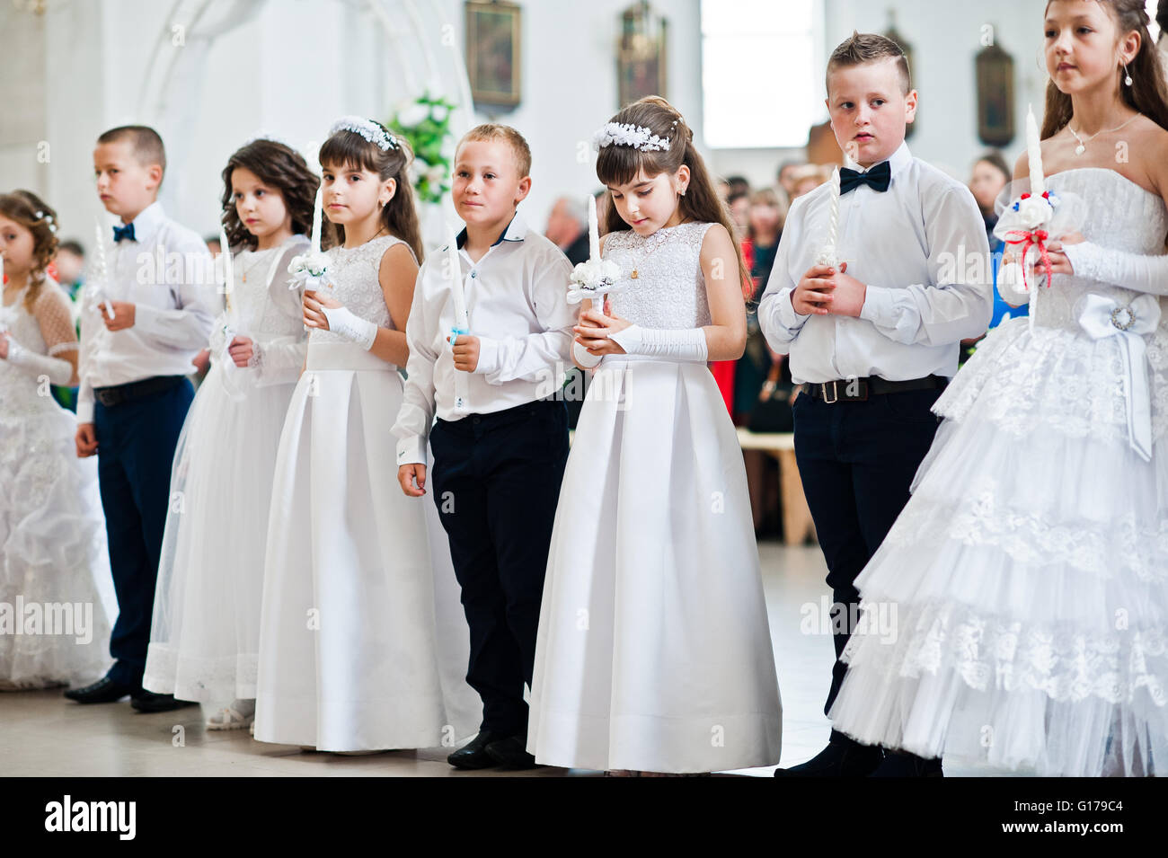 LVIV, UKRAINE - MAY 8, 2016: The ceremony of a First Communion in the ...