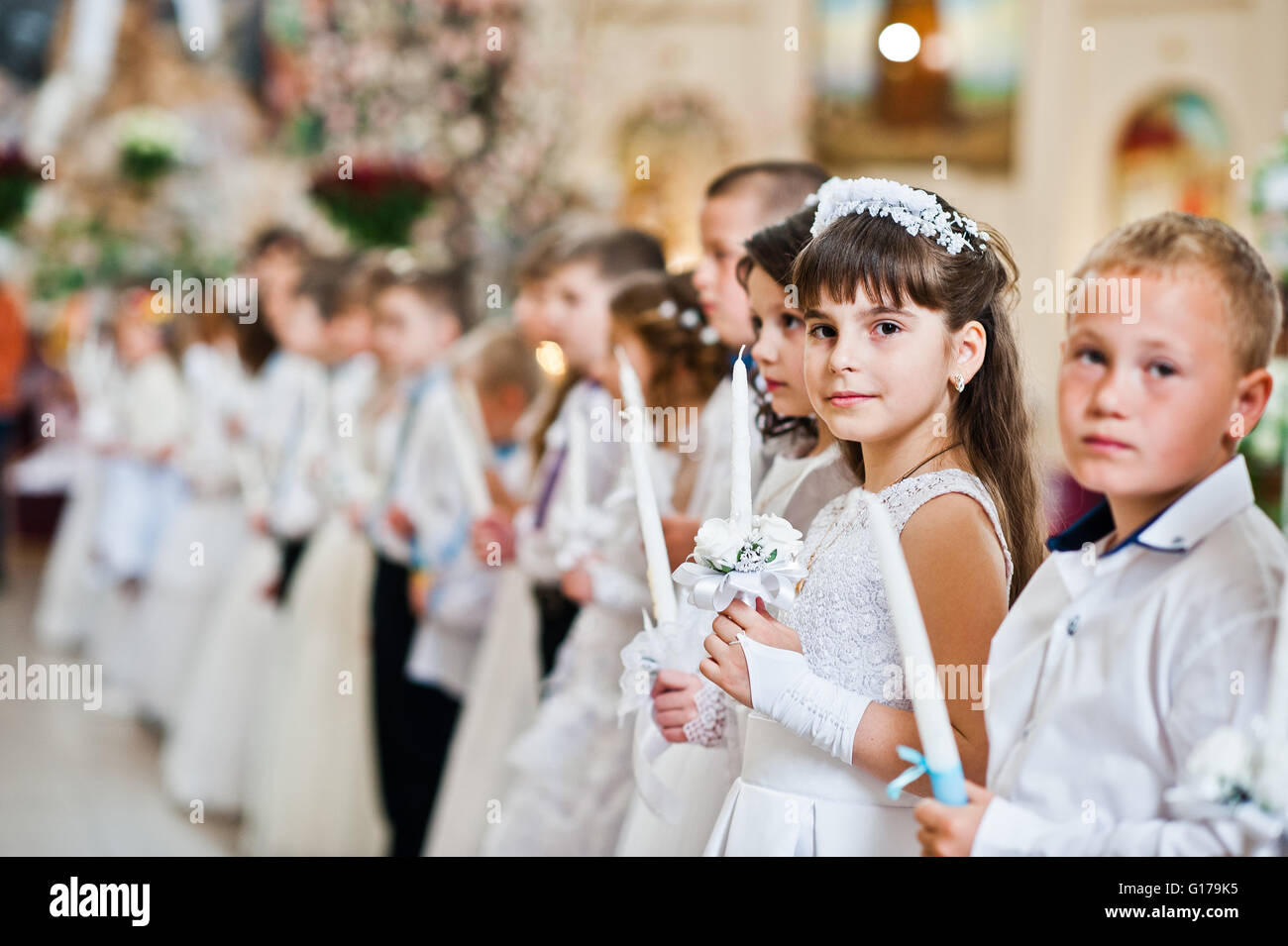 LVIV, UKRAINE - MAY 8, 2016: The ceremony of a First Communion in the ...