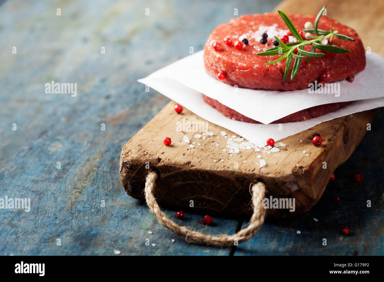 Raw Ground beef meat Burger steak cutlets with seasoning on vintage ...
