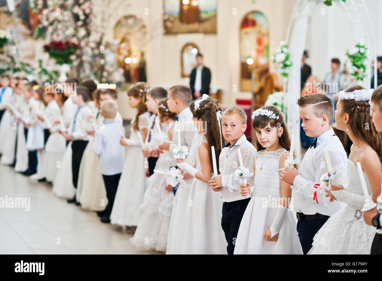 LVIV, UKRAINE - MAY 8, 2016: The ceremony of a First Communion in the ...