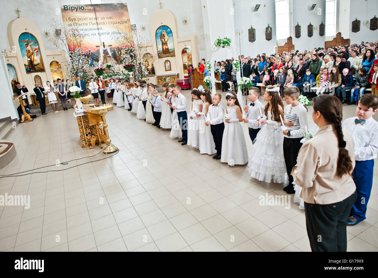 LVIV, UKRAINE - MAY 8, 2016: The ceremony of a First Communion in the ...