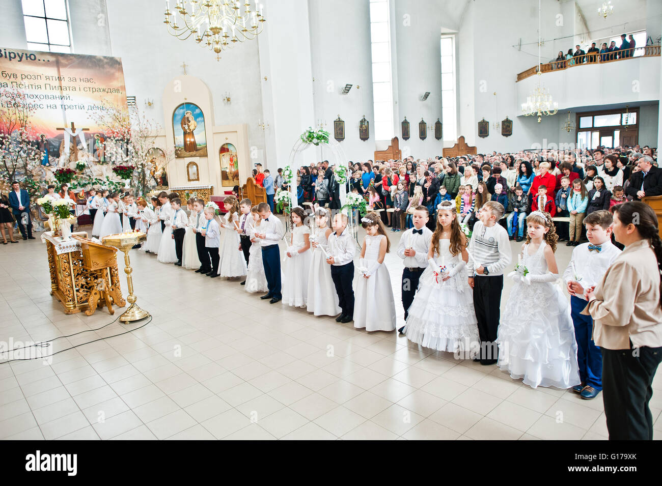 LVIV, UKRAINE - MAY 8, 2016: The ceremony of a First Communion in the ...