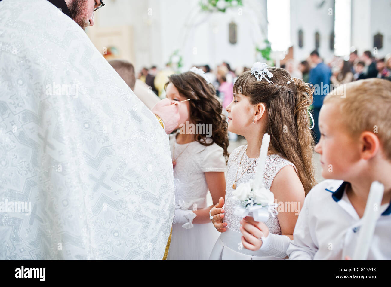 LVIV, UKRAINE - MAY 8, 2016: The ceremony of a First Communion in the ...