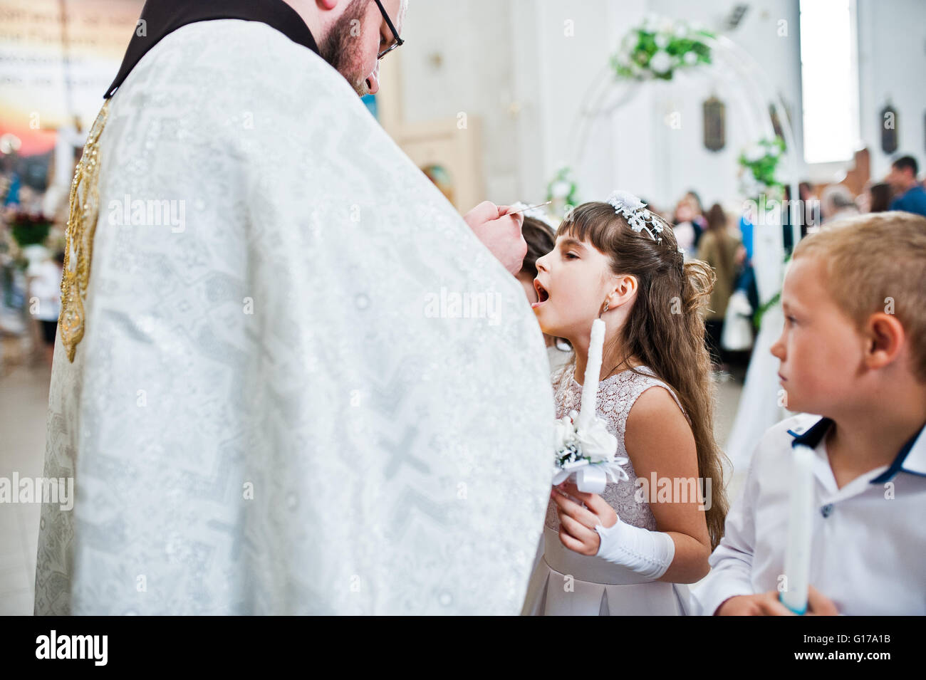 Communion in ukrainian catholic church hi-res stock photography and ...