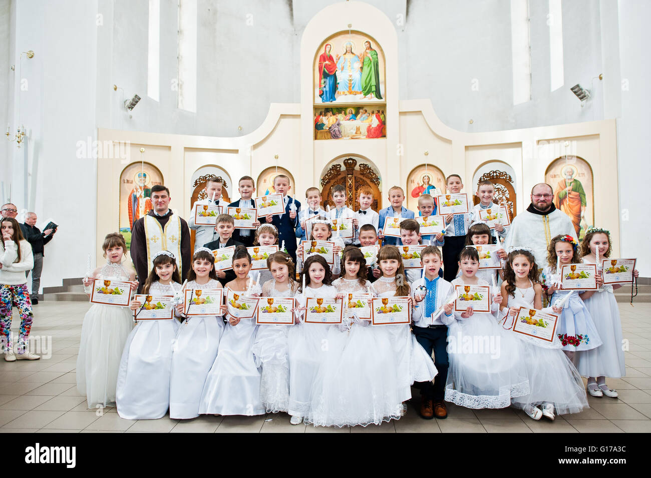 LVIV, UKRAINE - MAY 8, 2016: The ceremony of a First Communion in the ...