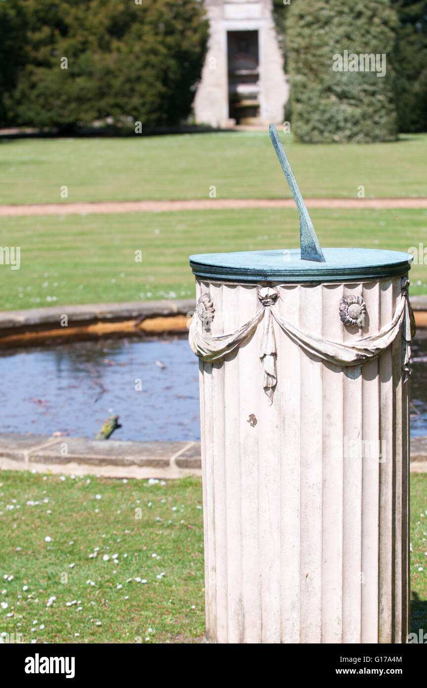 Sundial in the grounds of a garden in bright sunlight Stock Photo - Alamy