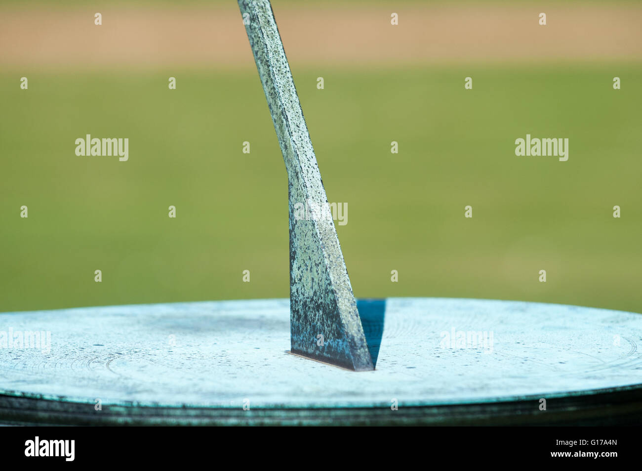 Sundial in the grounds of a garden in bright sunlight Stock Photo - Alamy