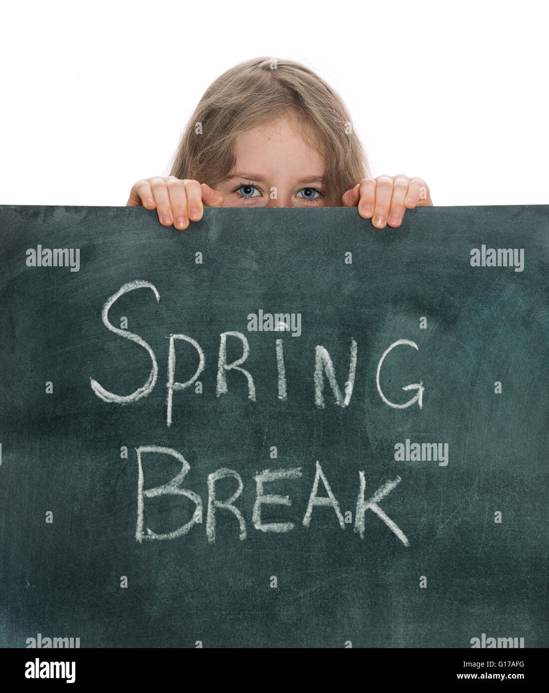 Schoolgirl hiding behind blackboard with Spring Break text Stock Photo ...