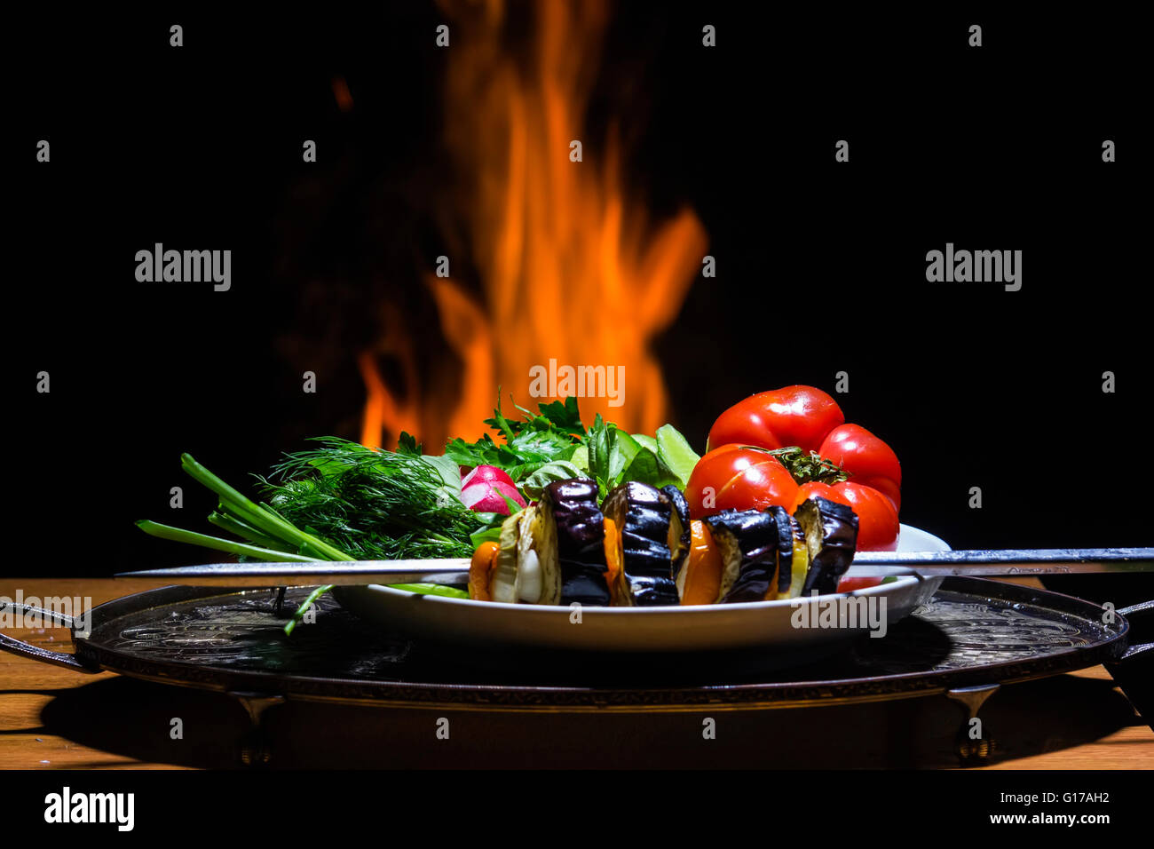vegetable and flame on background Stock Photo - Alamy