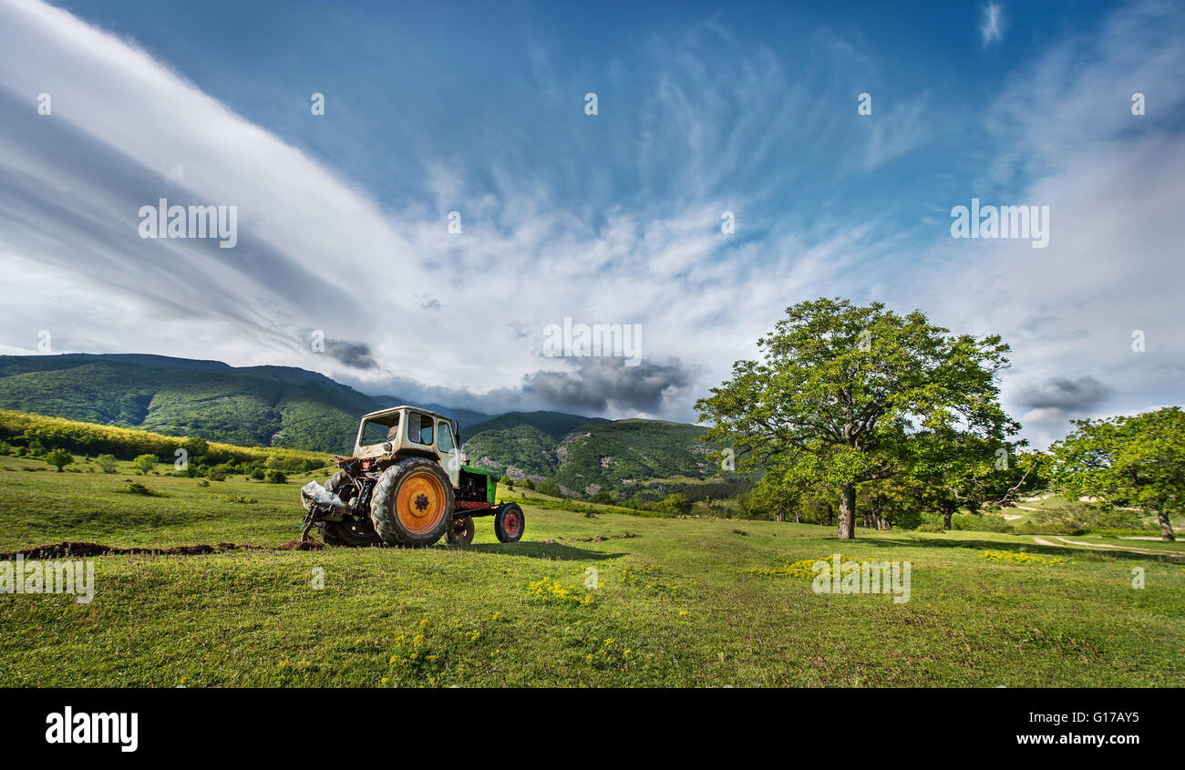 Тractor digging a channel for drainage of water in the mountains! Stock ...