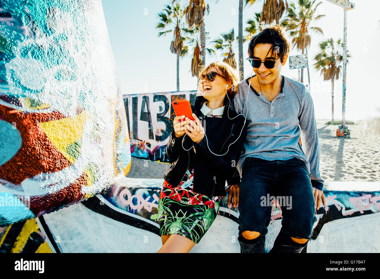 Female male sharing earphones hi-res stock photography and images - Alamy