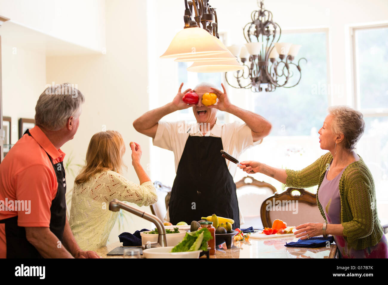 Group of seniors having fun in kitchen Stock Photo - Alamy