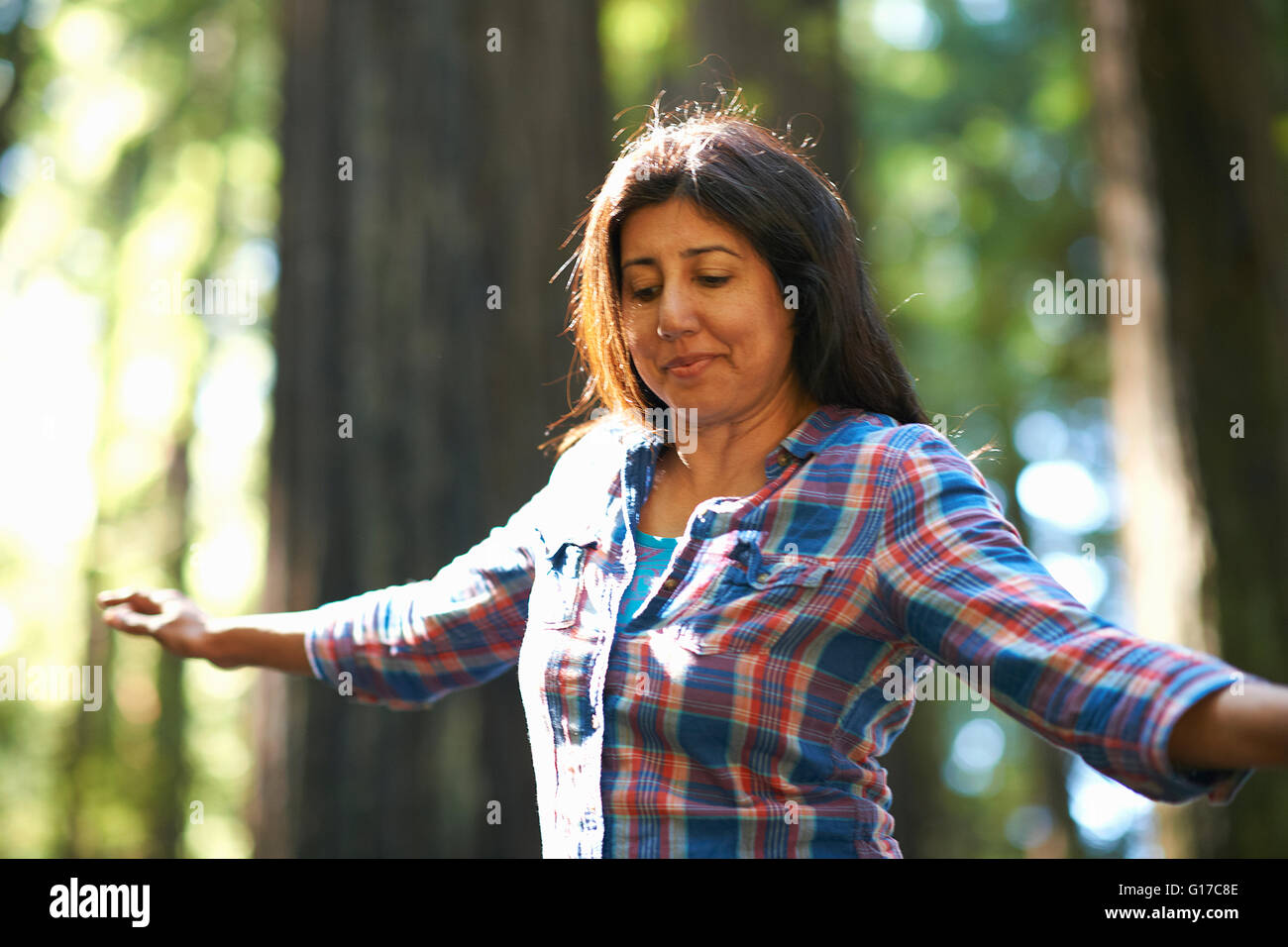 Woman balance walking in forest Stock Photo - Alamy