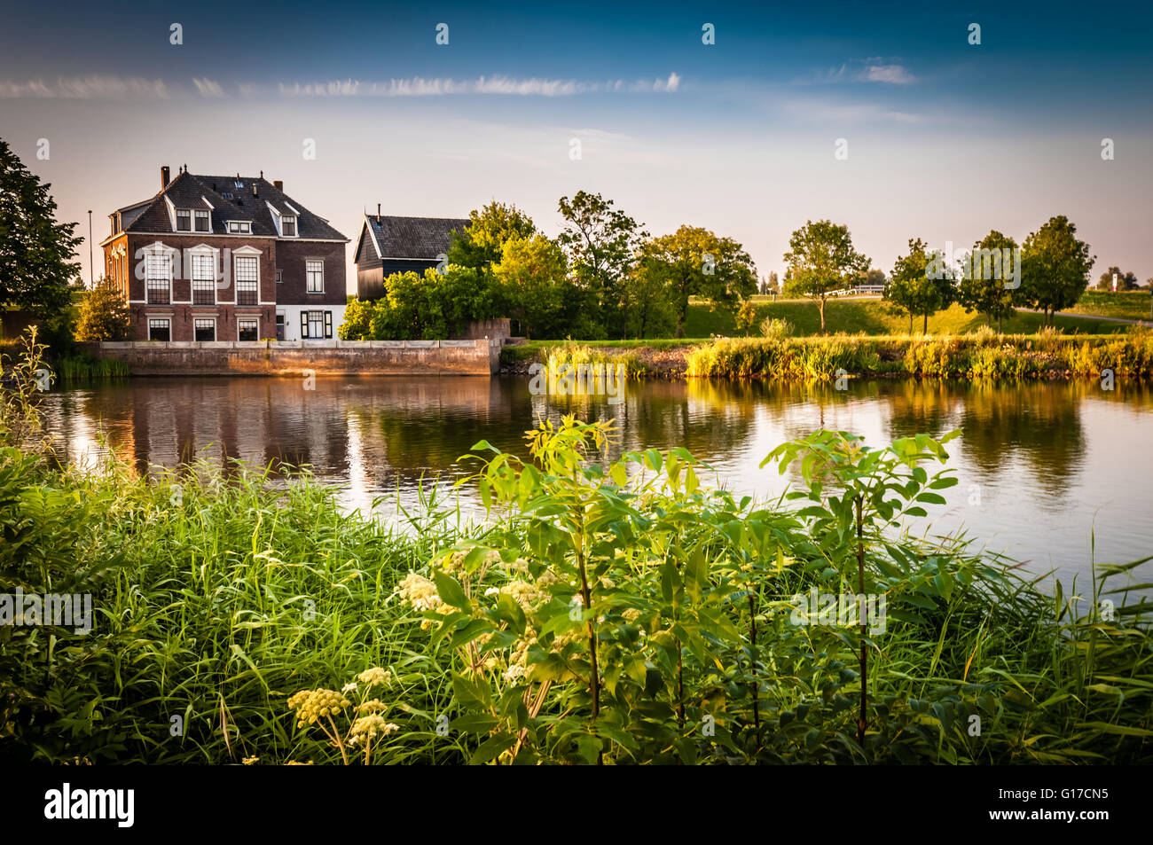 Dutch rural landscape with typical homes Stock Photo - Alamy