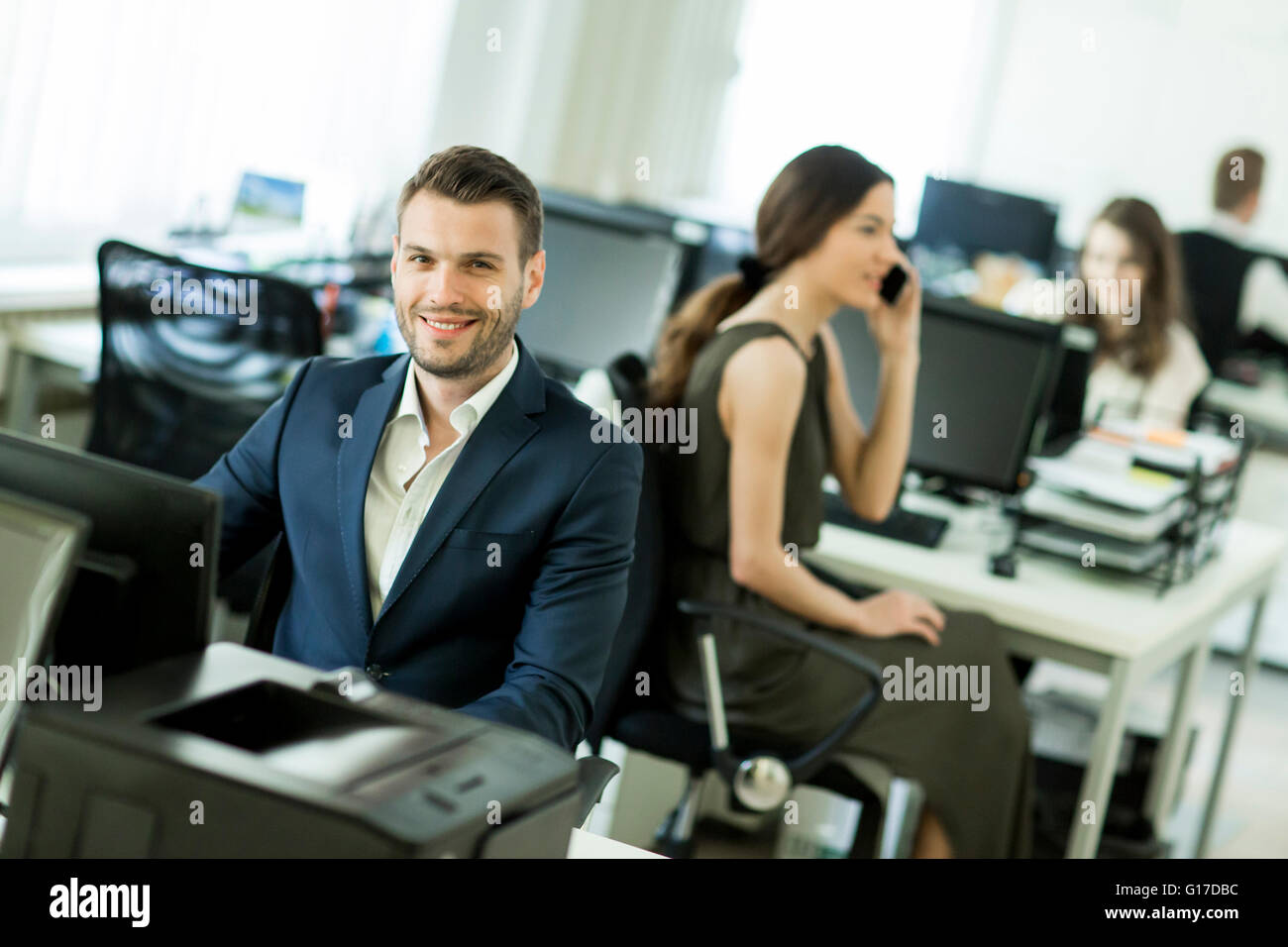 Professional man sitting desk hi-res stock photography and images - Alamy