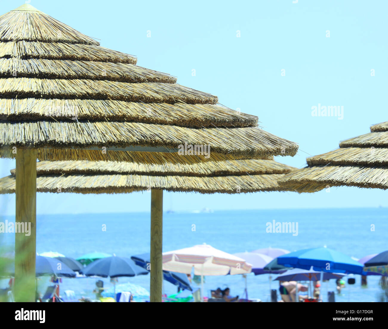 beach parasols made with bamboo and straw in the luxurious resort by ...