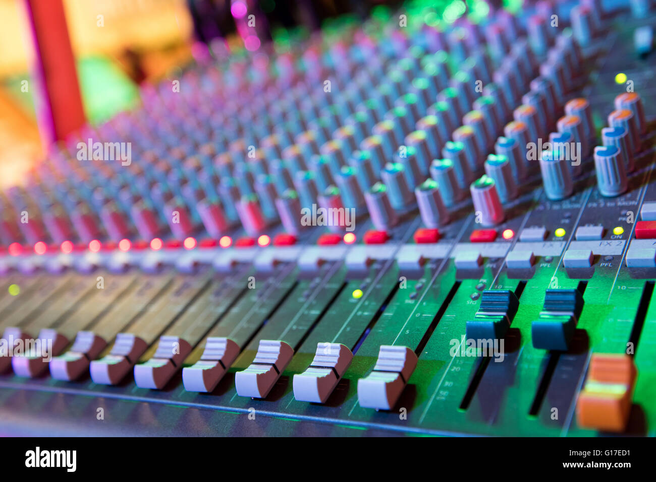 Detail view of music mixer with knobs. Filled with light Stock Photo ...