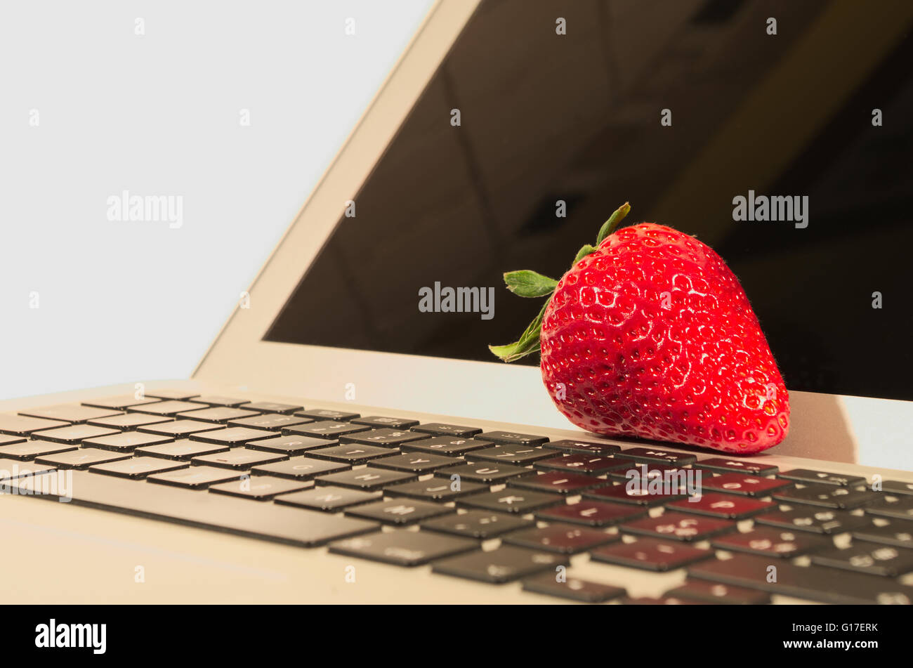 Just another fruit meets high-tech Stock Photo - Alamy