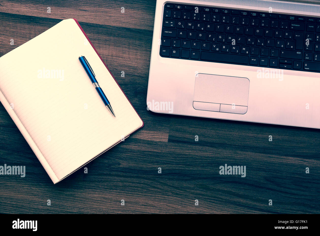 Office desk with computer and notebook Stock Photo - Alamy