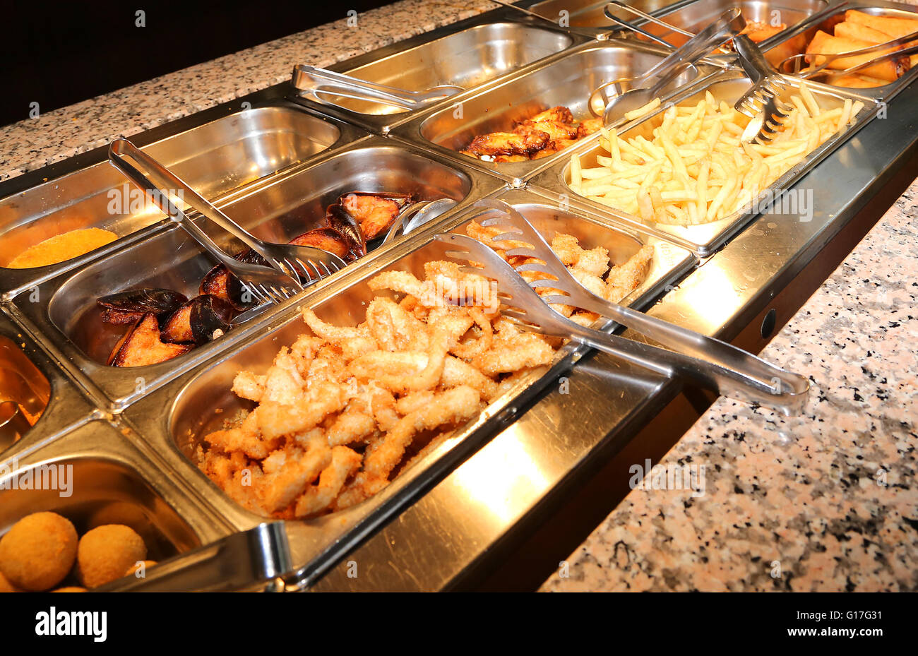 large stainless steel trays in the self-service area catering service ...