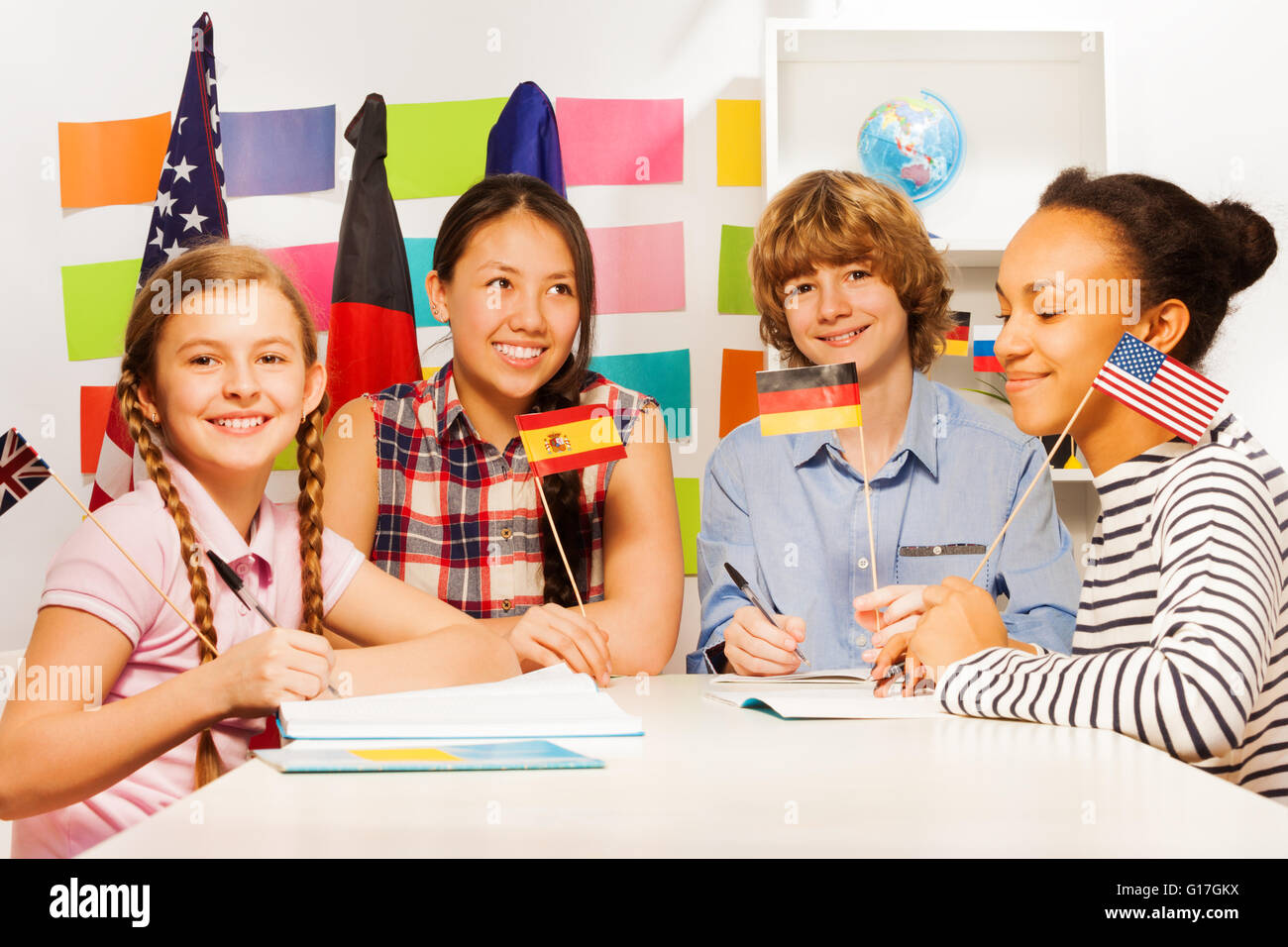 Multiethnic teenage students at language courses Stock Photo - Alamy