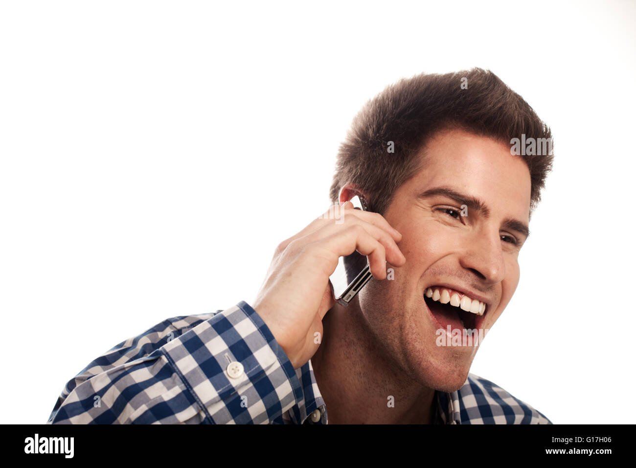 Casual man speaking over the phone over white studio background Stock ...