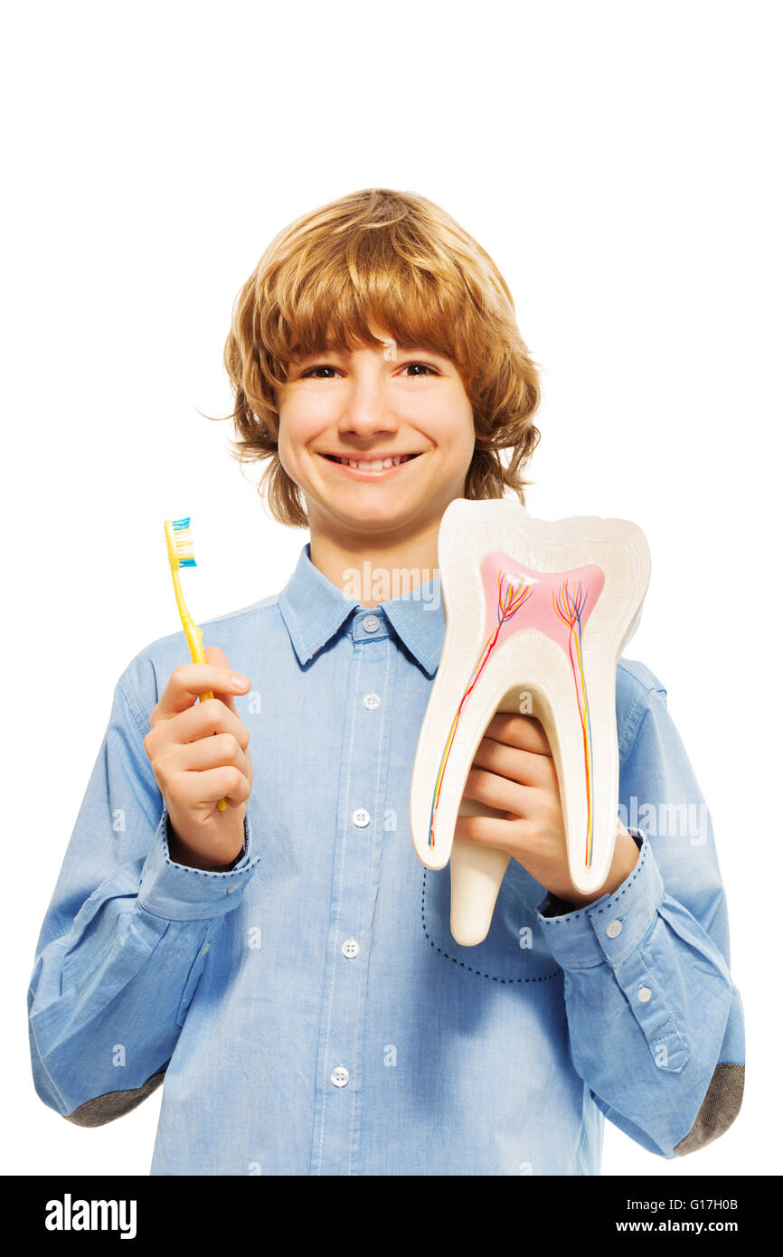 Smiling teen boy brushing teeth hi-res stock photography and images - Alamy