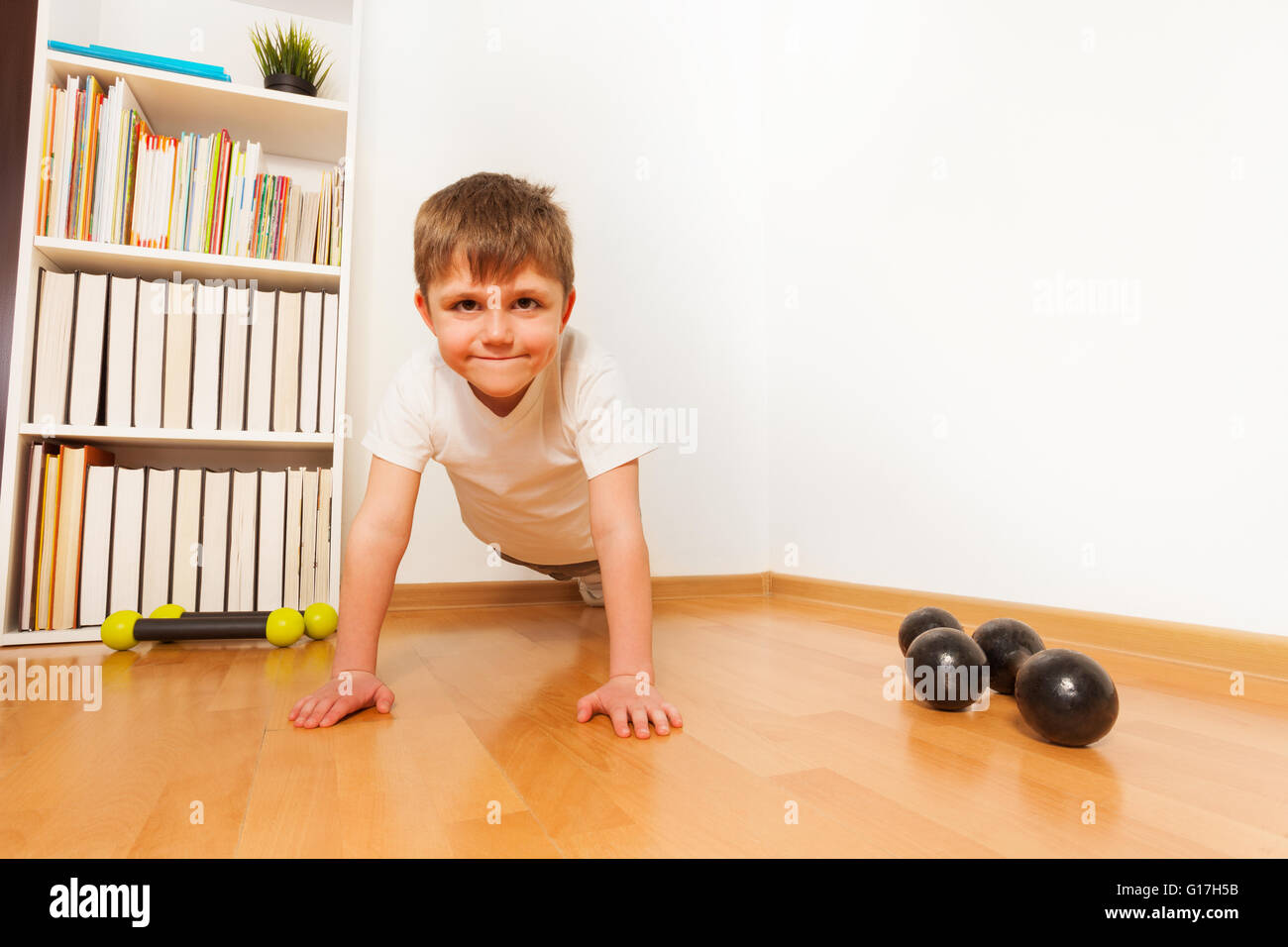 Push-ups or press-ups exercise by preschooler boy Stock Photo - Alamy