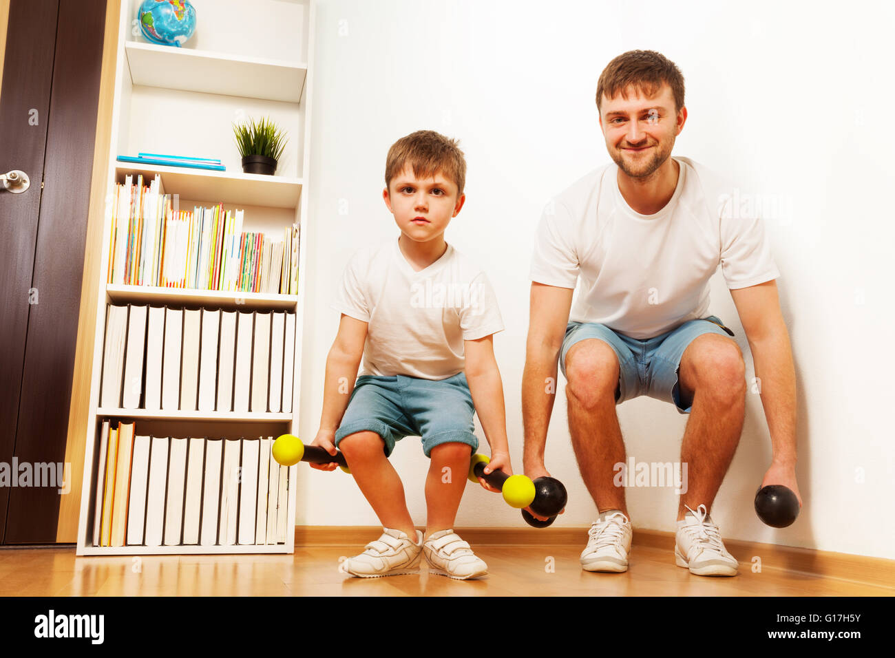 Father and kid son workout with dumbbells together Stock Photo - Alamy